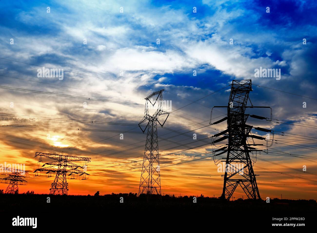 Pylon, high-voltage tower sky background Stock Photo - Alamy