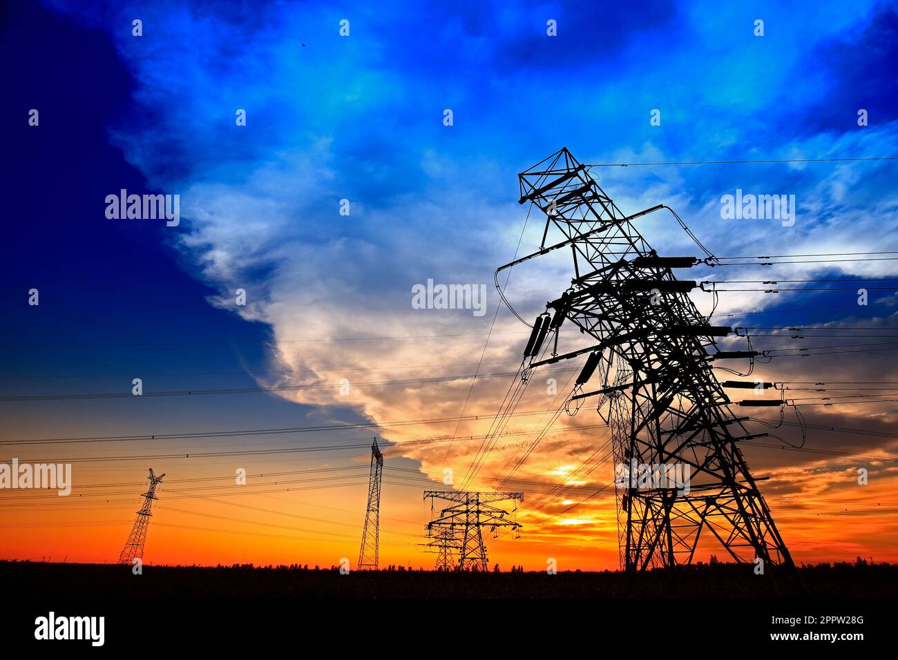 Pylon, high-voltage tower sky background Stock Photo - Alamy