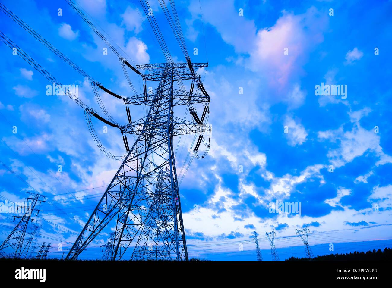 Electric tower, silhouette at sunset Stock Photo - Alamy