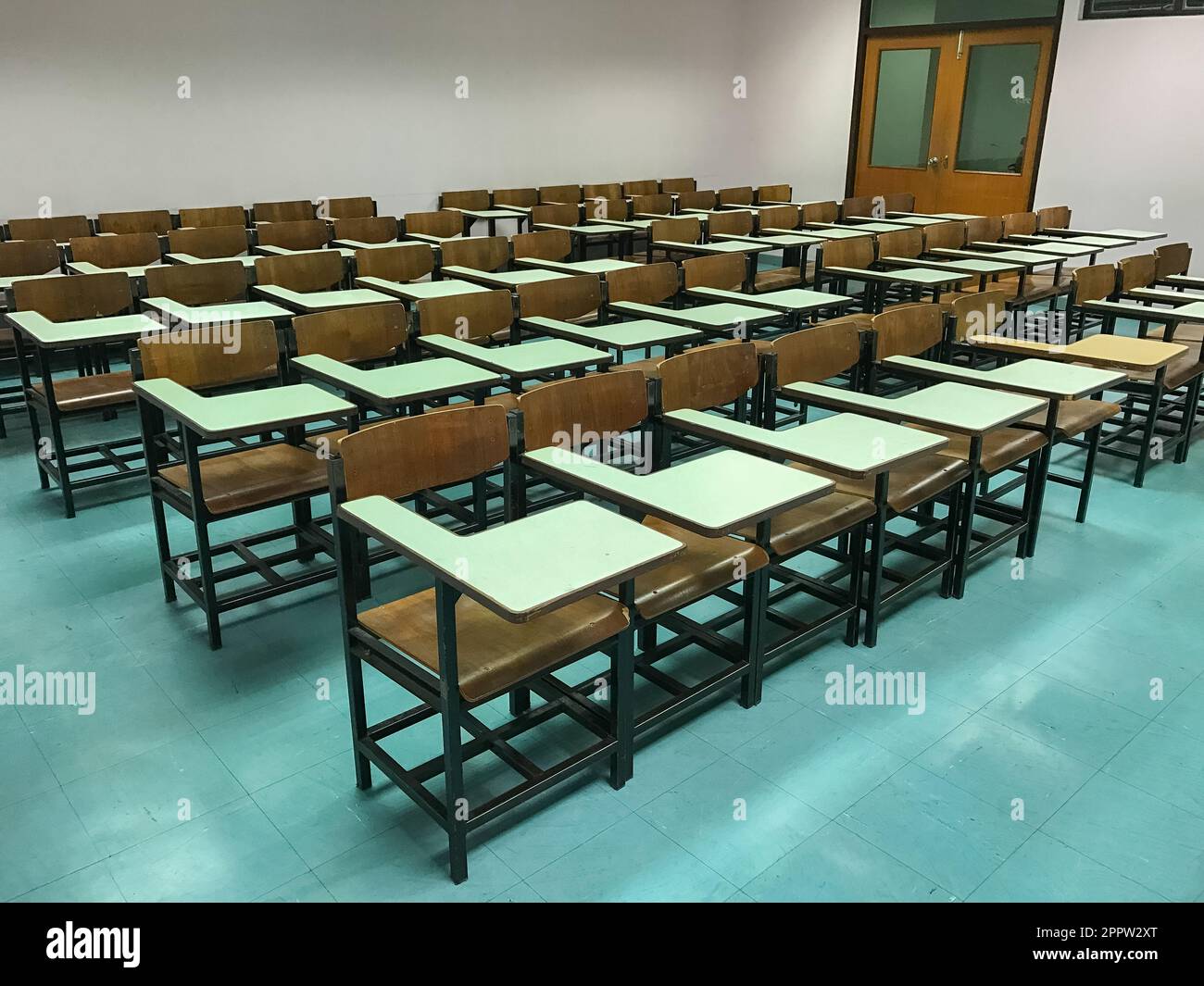 Wooden chairs in the classroom background Stock Photo - Alamy