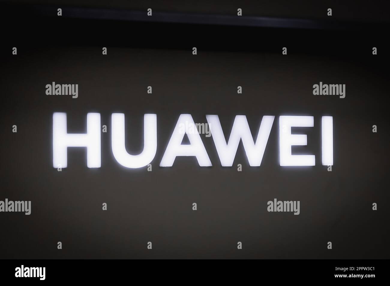 Close-up on the HUAWEI logo on a decorative wall in store Stock Photo ...
