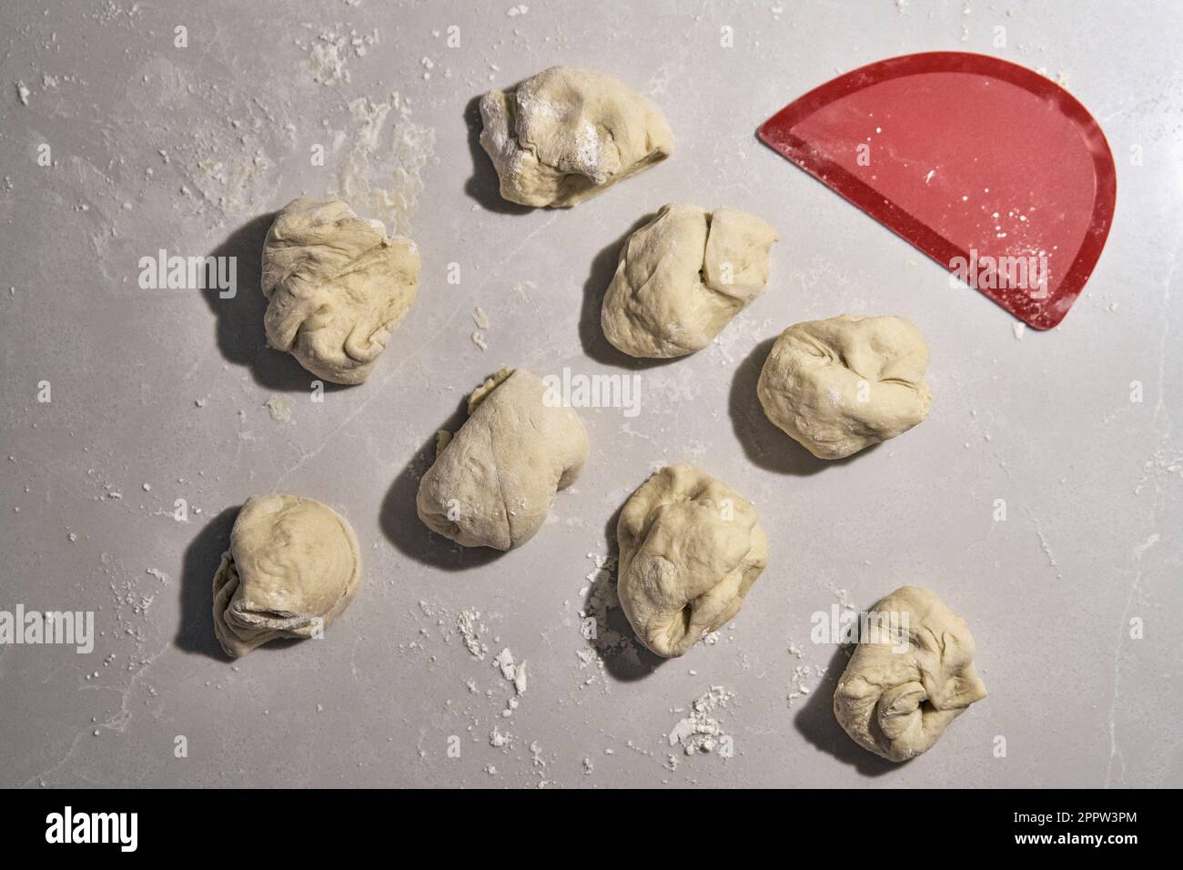 Still life view from above bread roll dough and dough cutter Stock ...