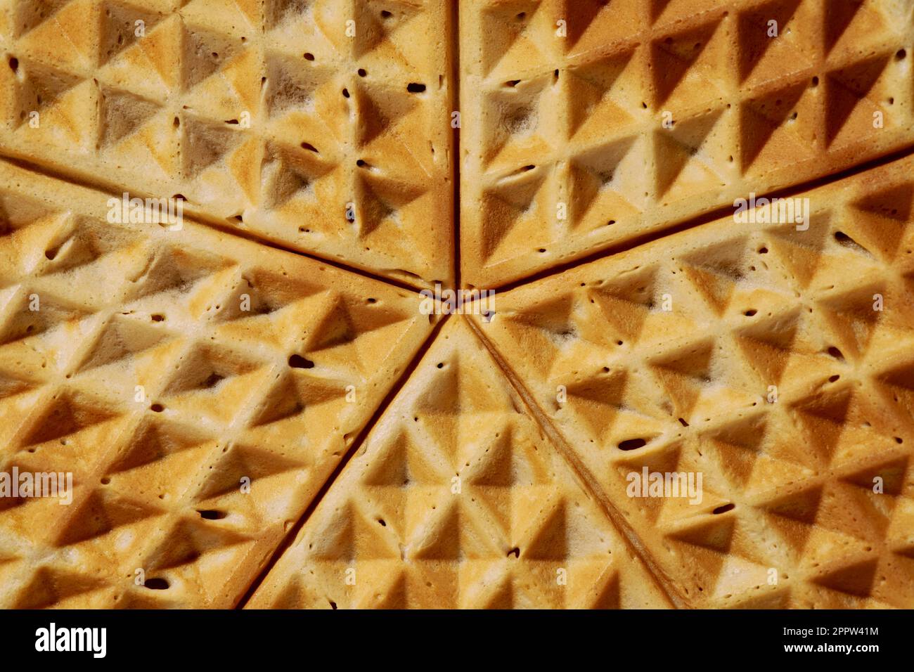 Extreme close up textured corners of waffles Stock Photo - Alamy