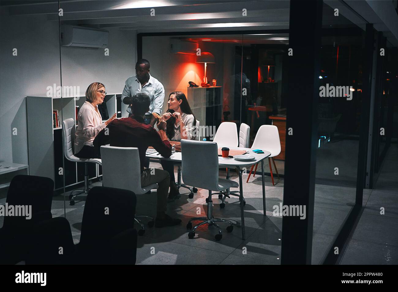 Put in time, push out results. colleagues having a meeting during a ...