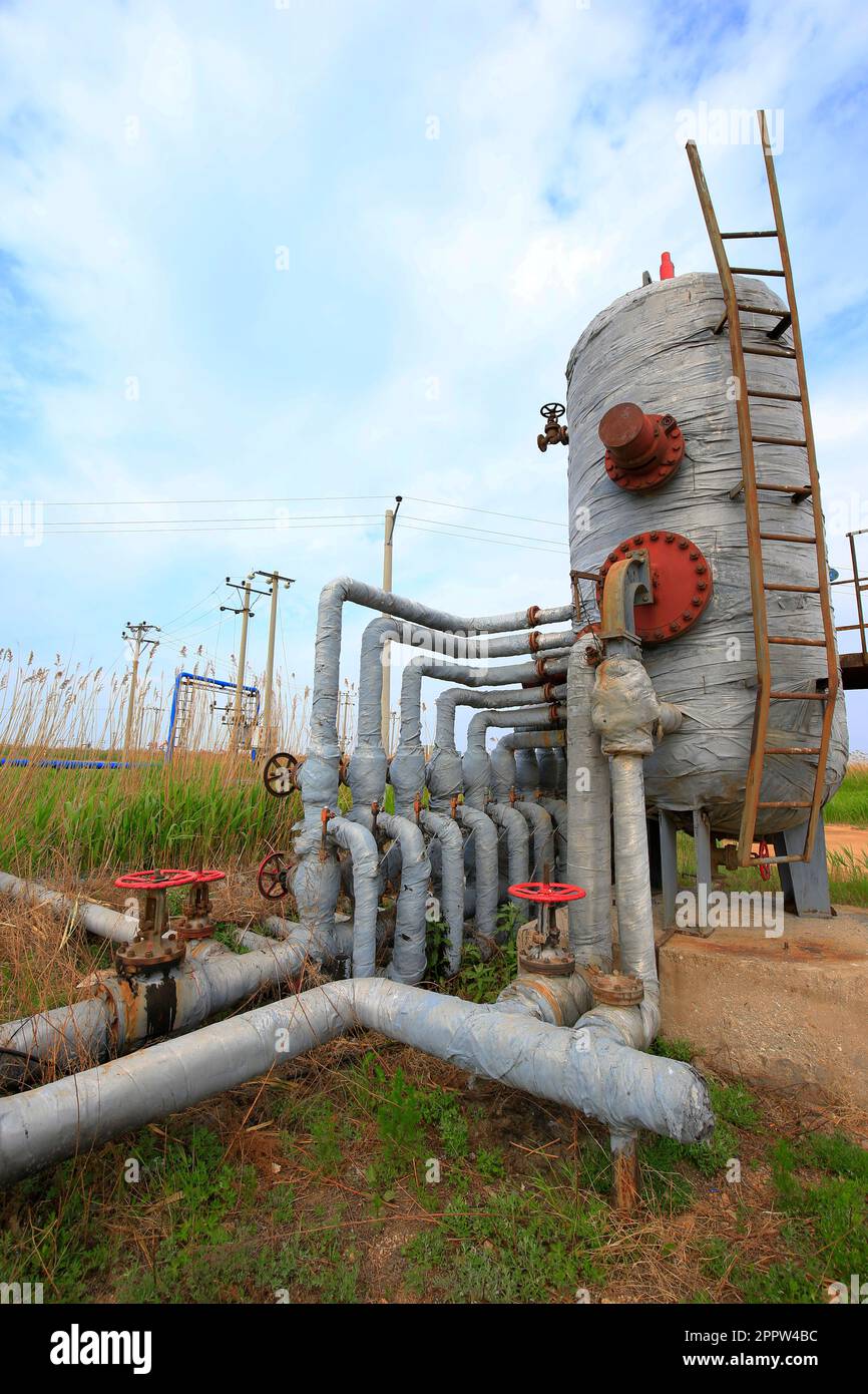 Oil pipes and valves Stock Photo - Alamy