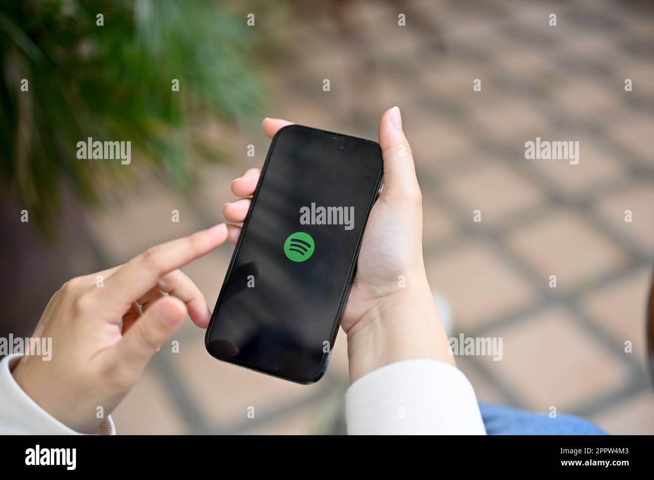 Female using spotify hi-res stock photography and images - Alamy