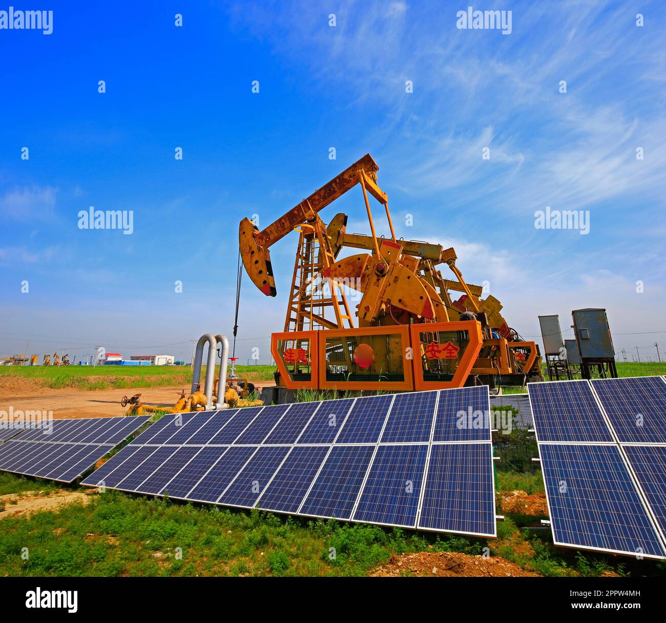 Oil pump with solar panels, industrial equipment Stock Photo - Alamy