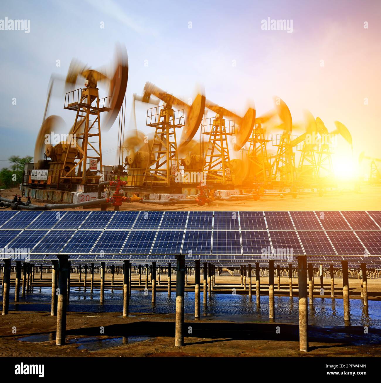 Oil pump with solar panels, industrial equipment Stock Photo - Alamy