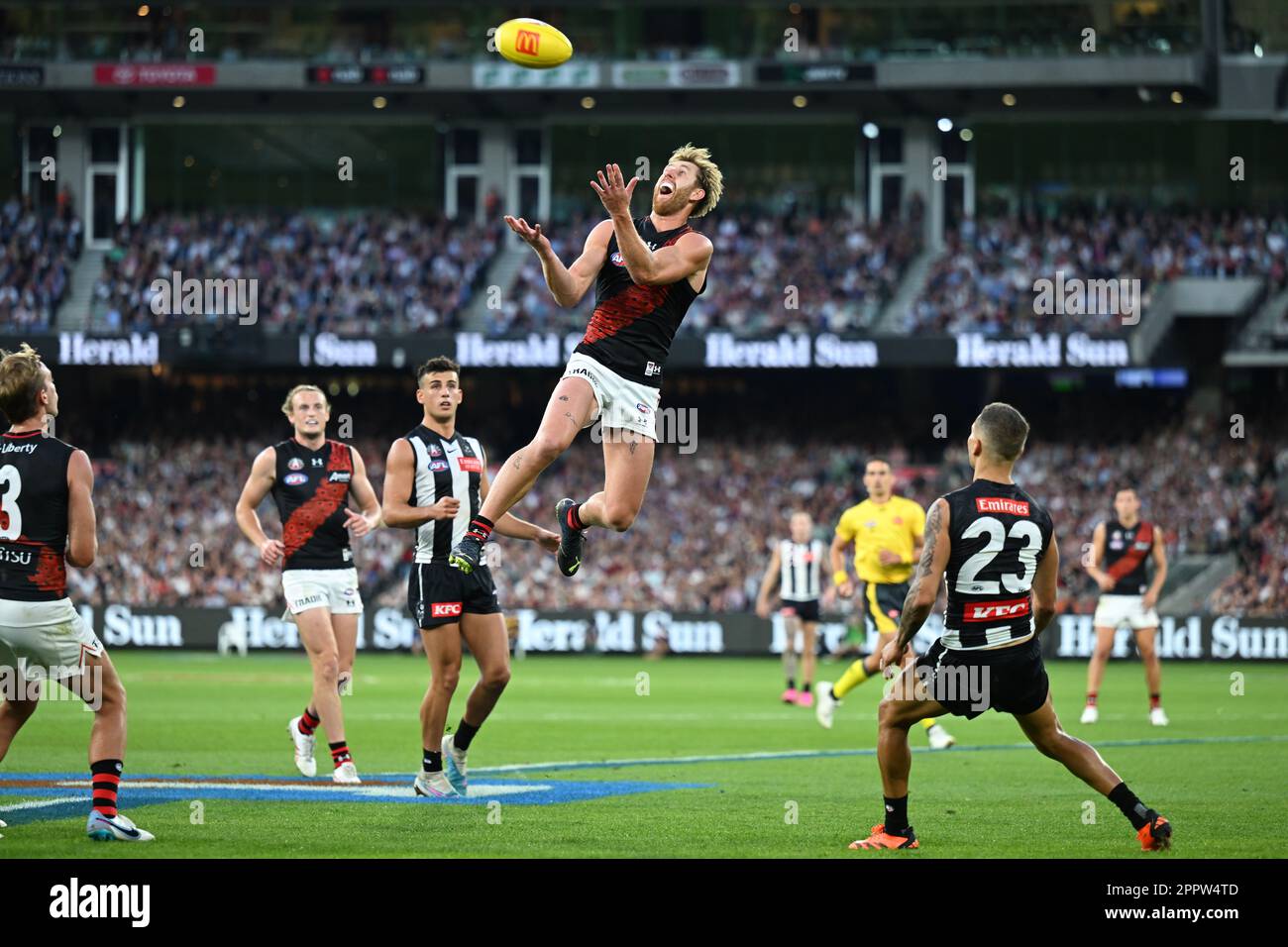 Dyson Heppell of Essendon (centre) marks the footy during the AFL Round ...