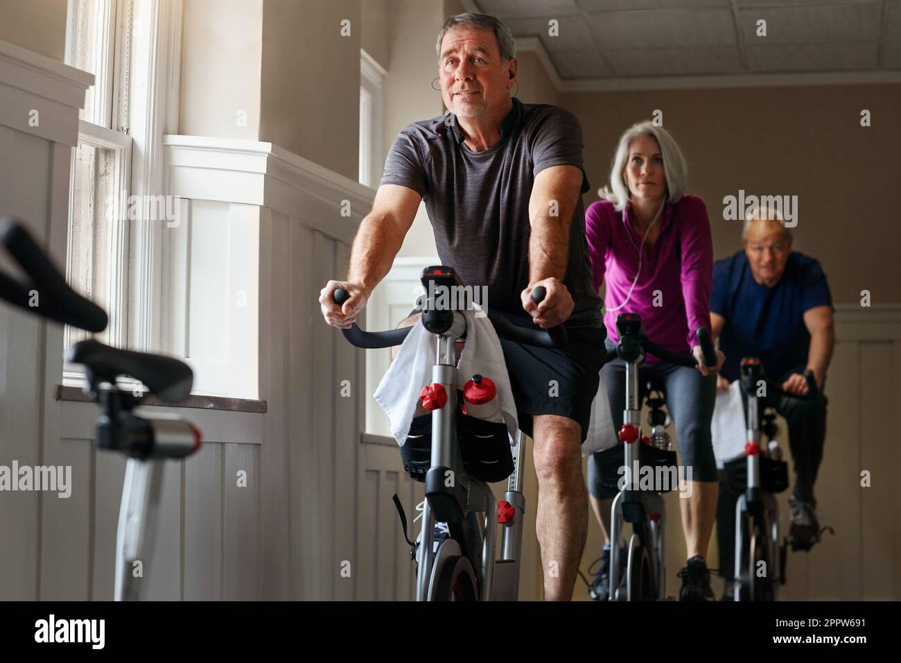 The three spinners spinning together towards fitness victory. a group ...
