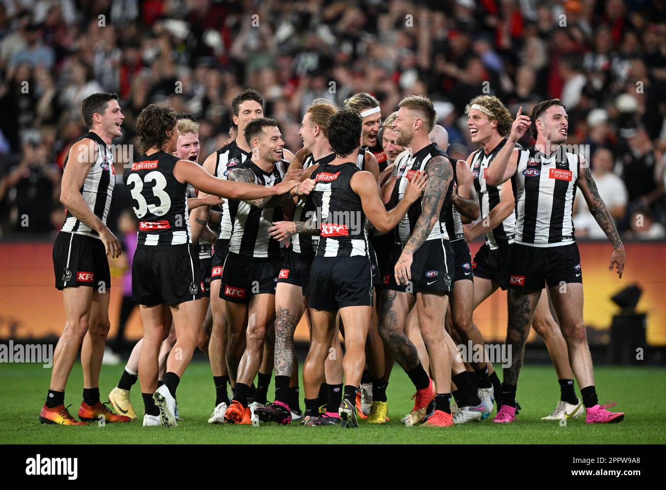 Collingwood players celebrate defeating Essendon in the AFL Round 6 ...