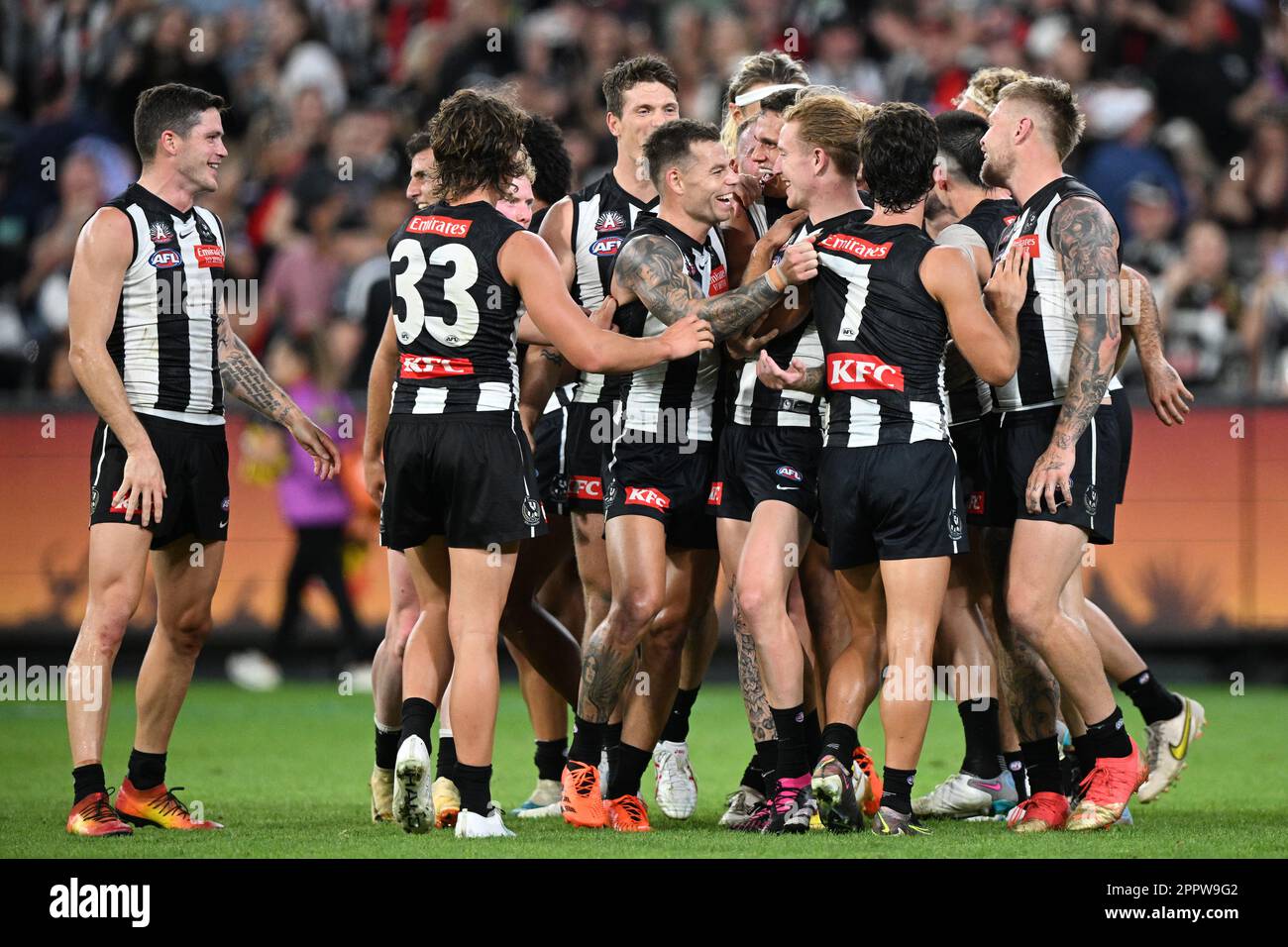 Collingwood players celebrate defeating Essendon in the AFL Round 6 ...