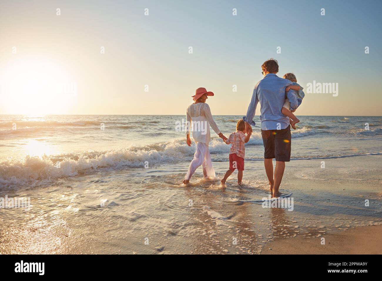 It sure has been a memorable day. a young family enjoying a day at the ...