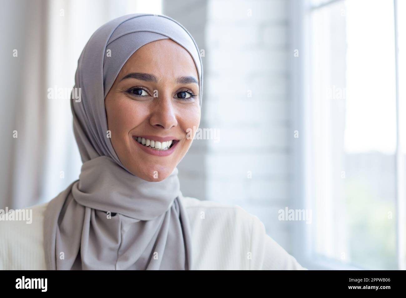 Close-up portrait of young beautiful arab woman, muslim woman in hijab ...