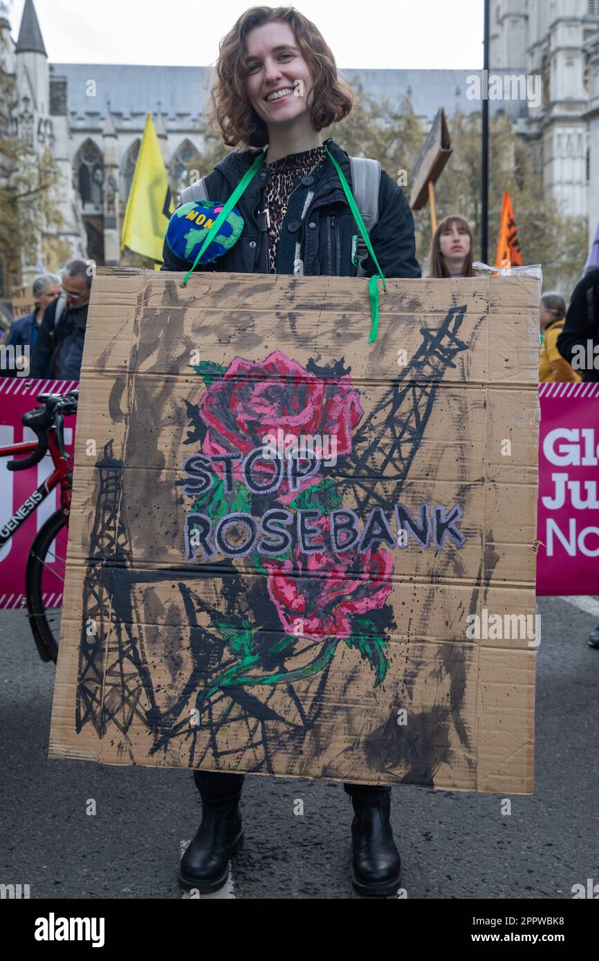 London, UK. 24th April, 2023. A Stop Rosebank activist prepares to ...