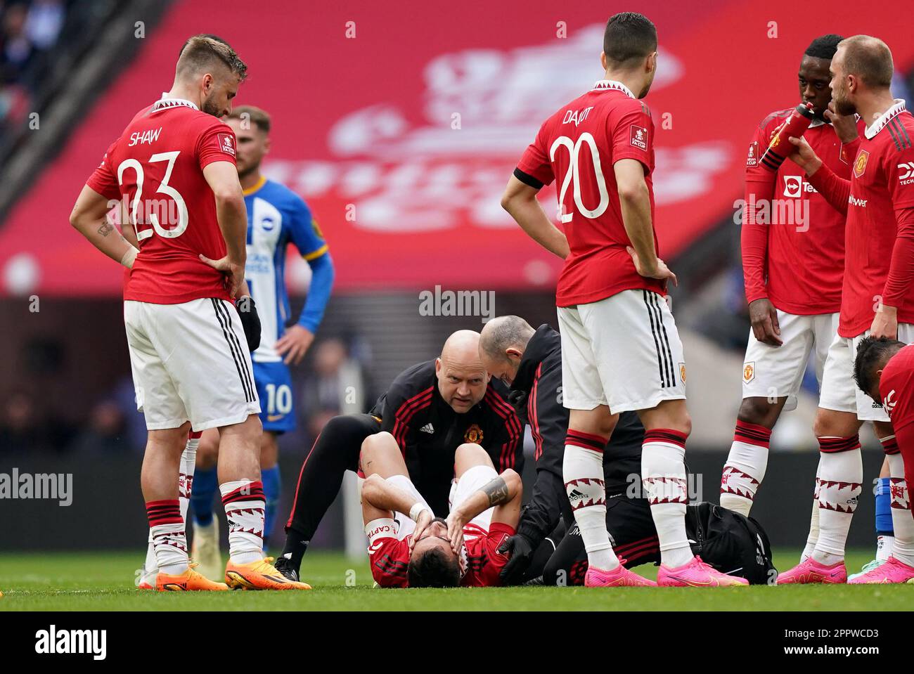Manchester United's Bruno Fernandes recieves treatment for an injury ...
