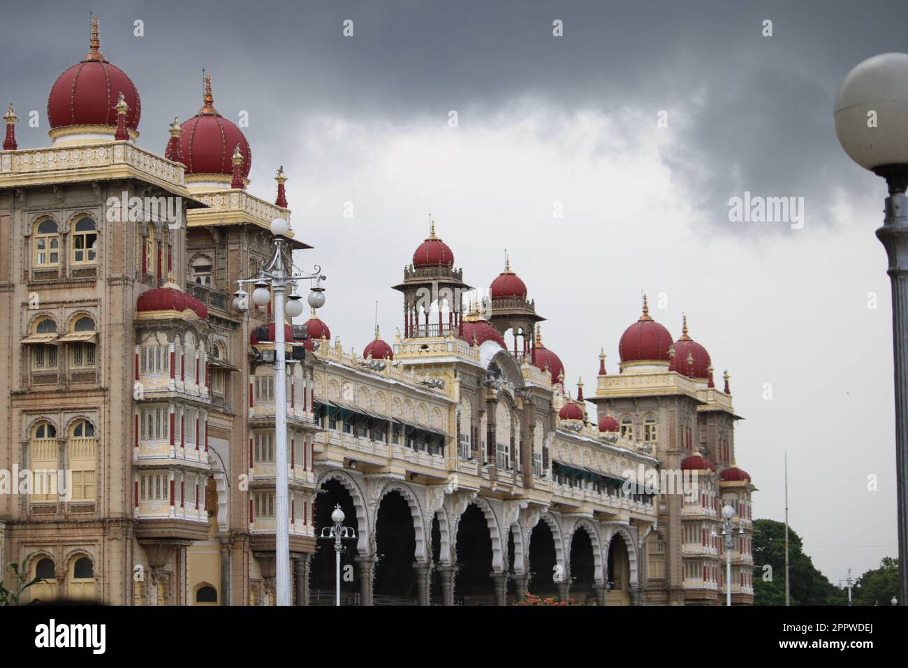 The ornate Mysore Palace building with red dome-shaped roofs on the ...