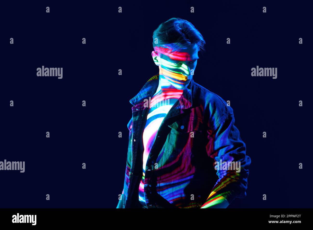 Creativity of human being. Handsome young guy with digital neon filter ...