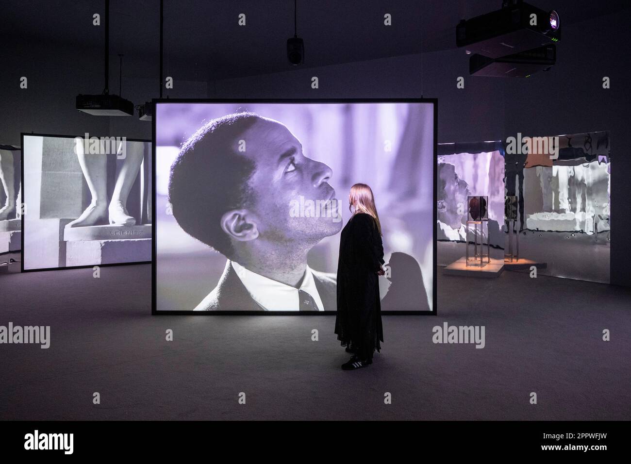 London, UK. 25 April 2023. A staff member with 'Once Again ... (Statues ...