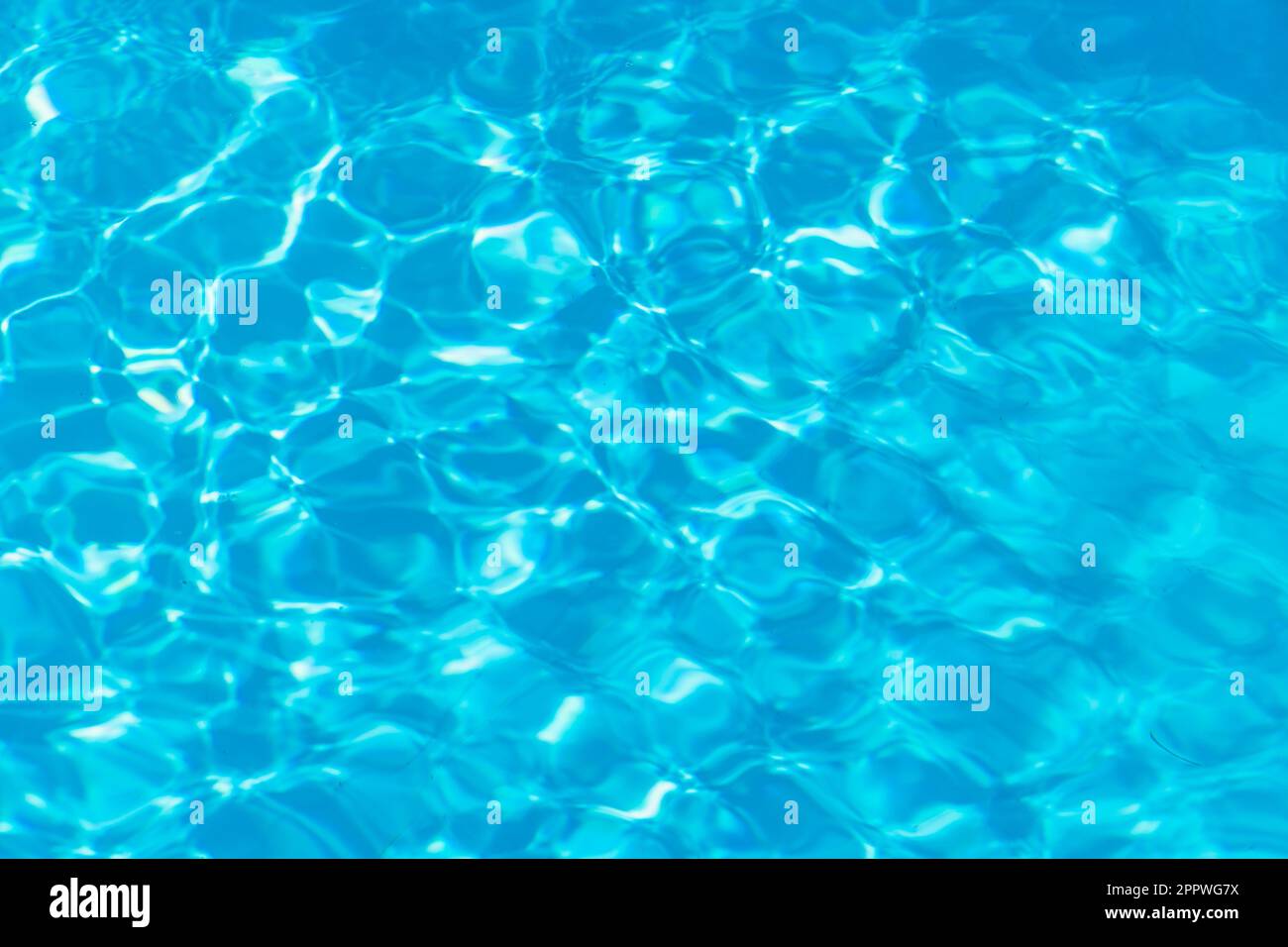 Blue pool water with sun reflections background Stock Photo - Alamy