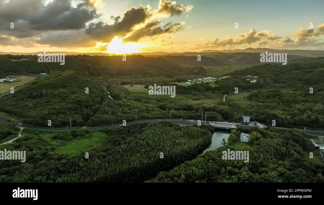 A beautiful landscape of lush green vegetation and a tranquil river ...