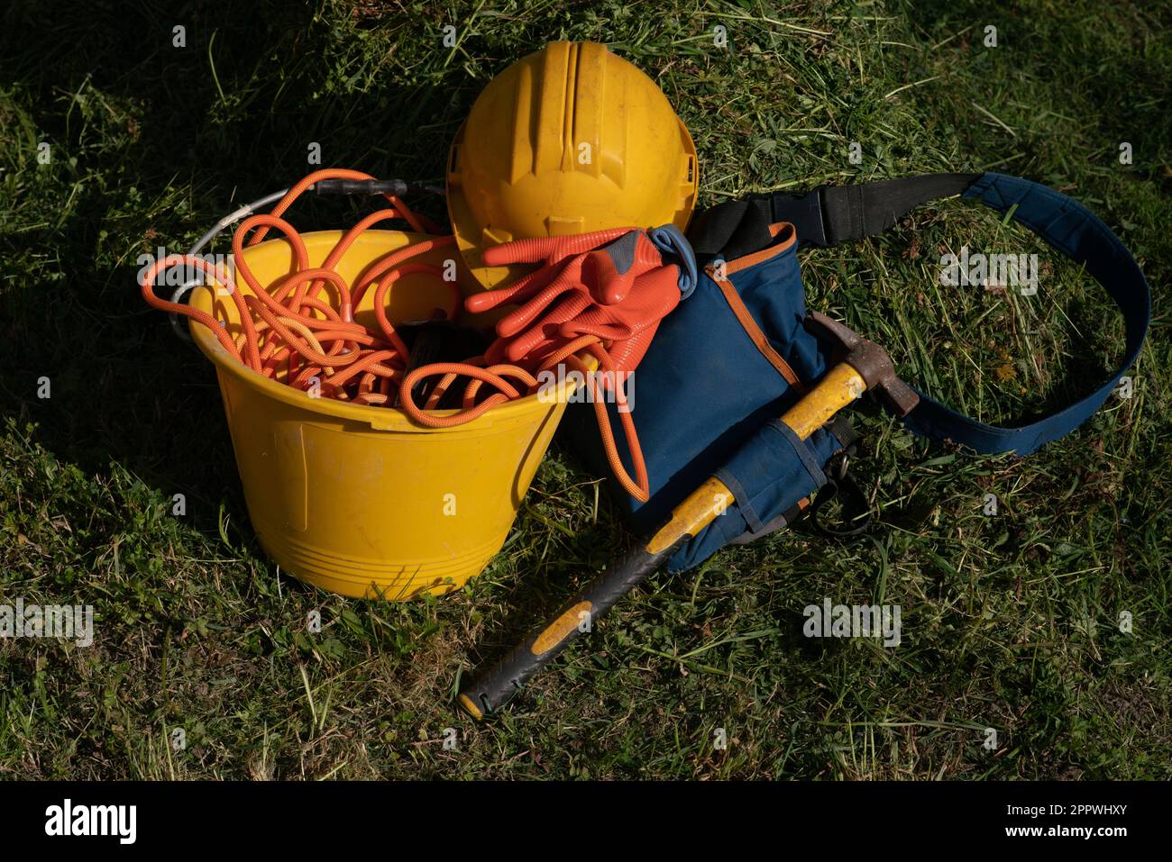 work on construction sites, individual protection of helmet, hammer and ...