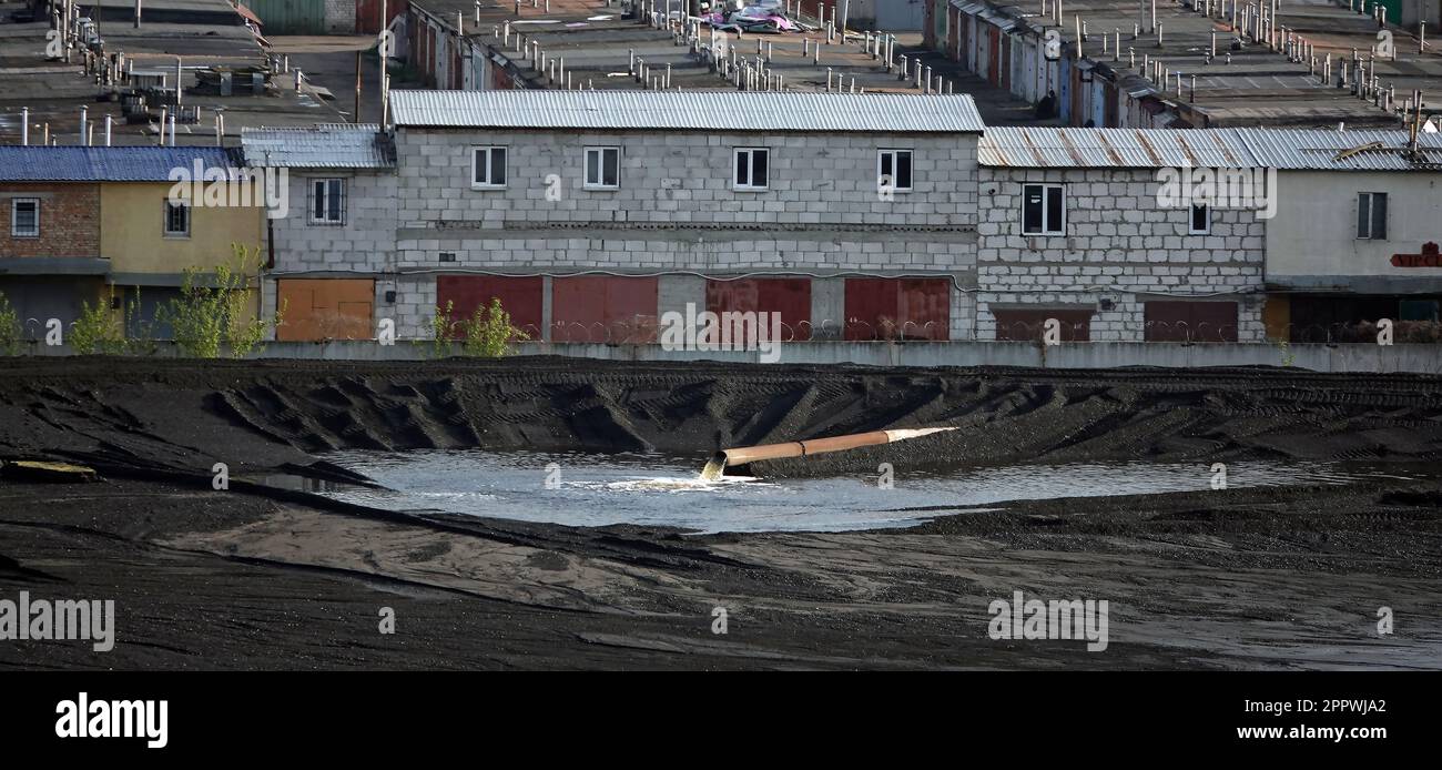 Kyiv, Ukraine April 23, 2023: The pipe pours out dirty sewage ...