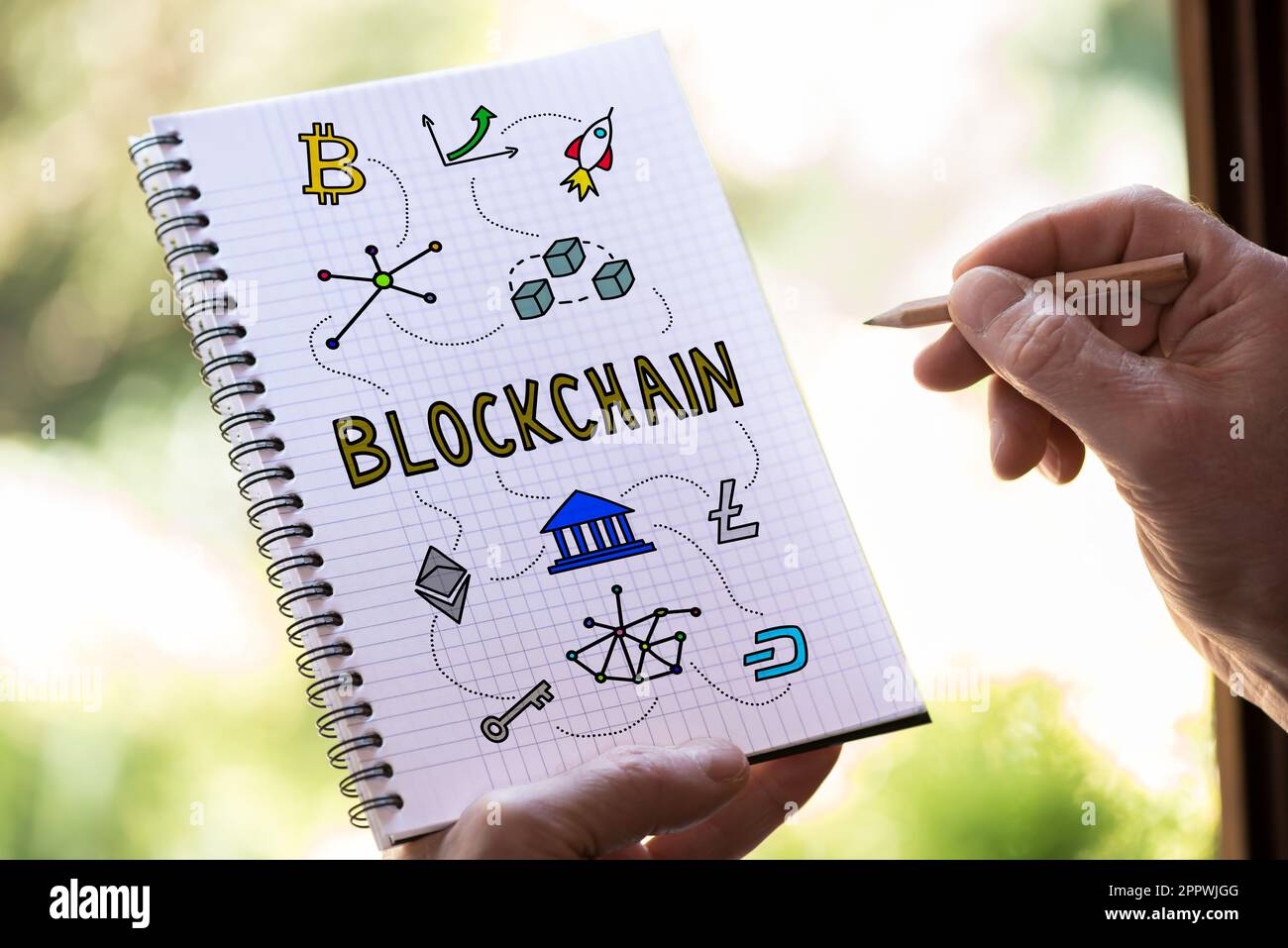 Hand drawing blockchain technology concept on a notepad Stock Photo - Alamy