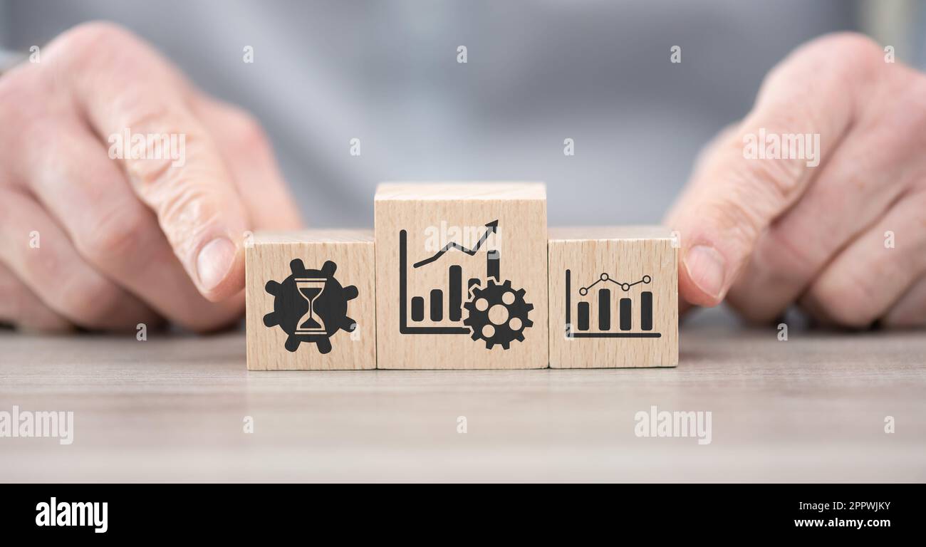 Wooden blocks with symbol of productivity concept Stock Photo - Alamy