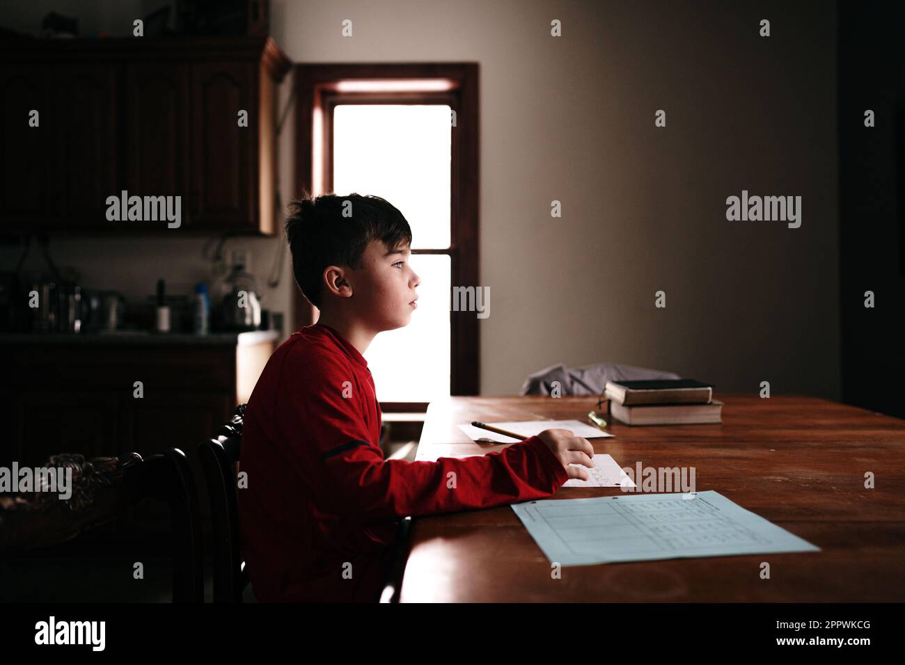 Boy at dining table hi-res stock photography and images - Alamy