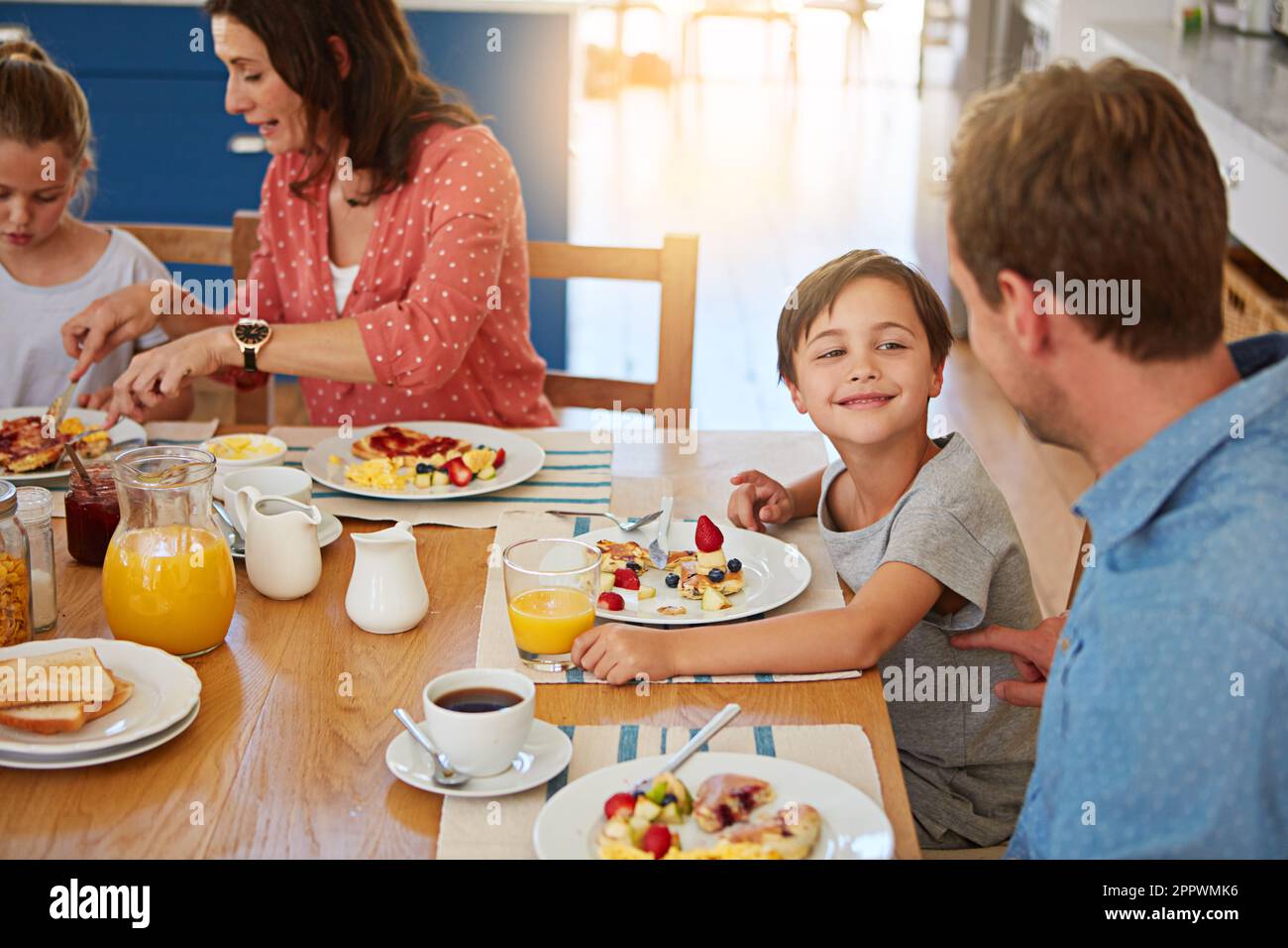 Are you ready to take on the day. a family of four enjoying breakfast ...