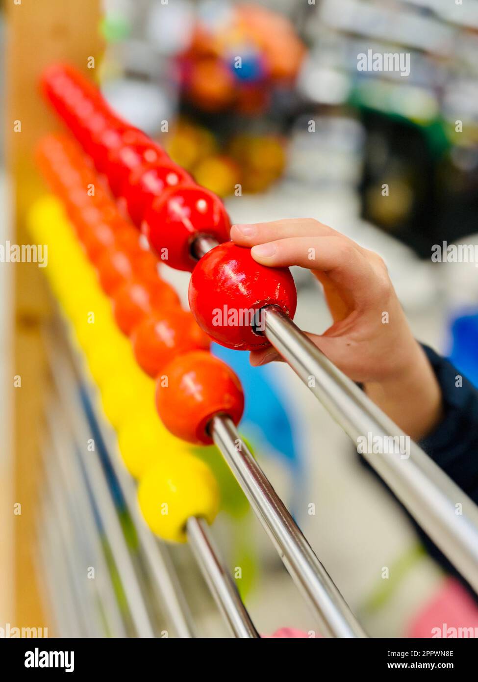 Close-up of a child's hand counting on an abacus Stock Photo - Alamy