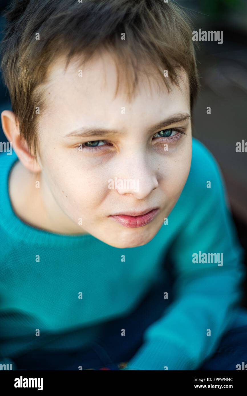 Scowling boy hi-res stock photography and images - Alamy