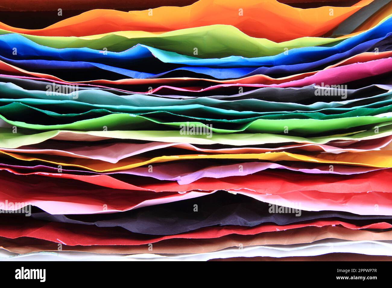 crumpled color papers as very easy background Stock Photo - Alamy