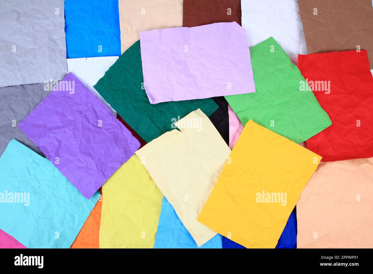 crumpled color papers as very easy background Stock Photo - Alamy