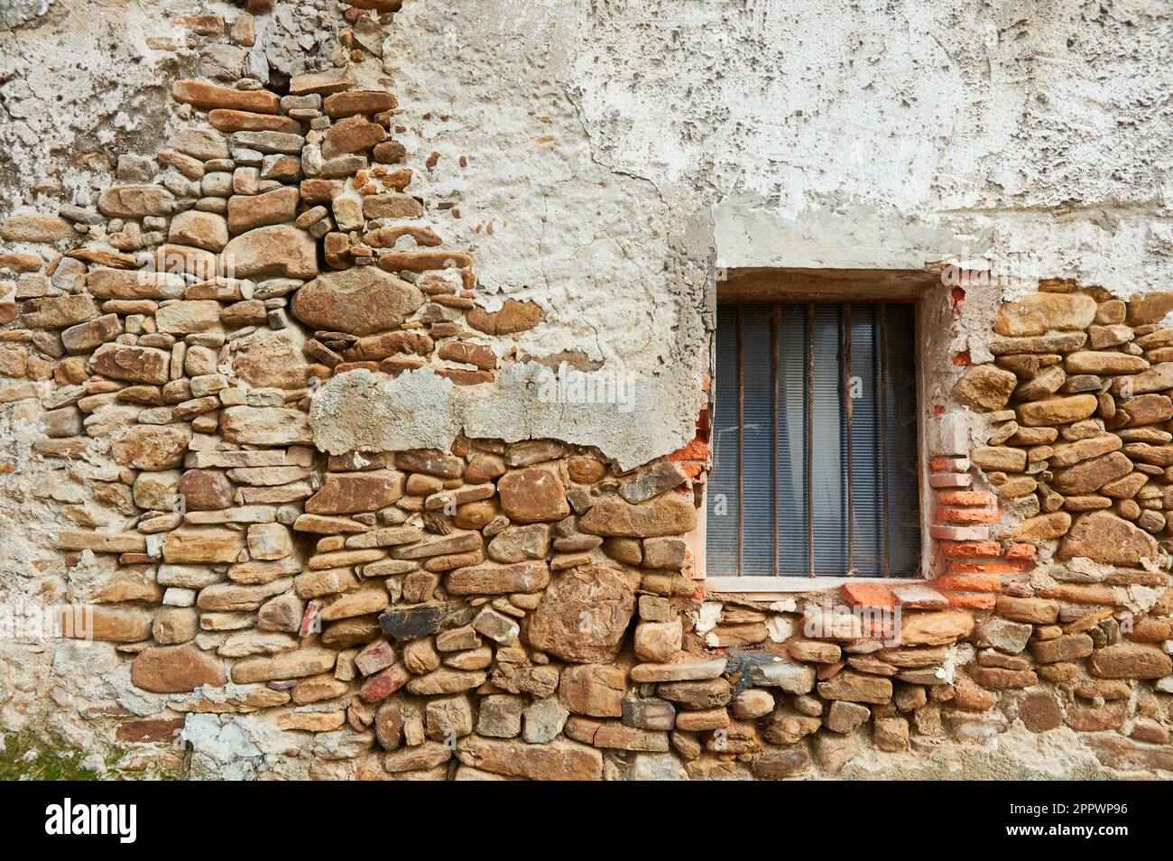 Ancient stone rough facade with window Stock Photo - Alamy