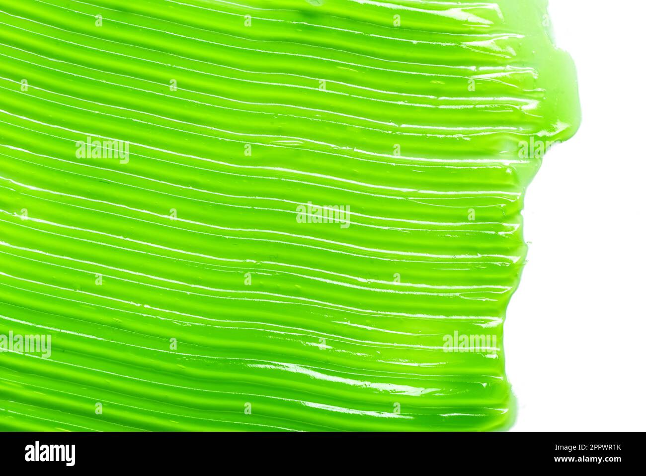 Green gel slime, cosmetic product as background, skin care mask or ...