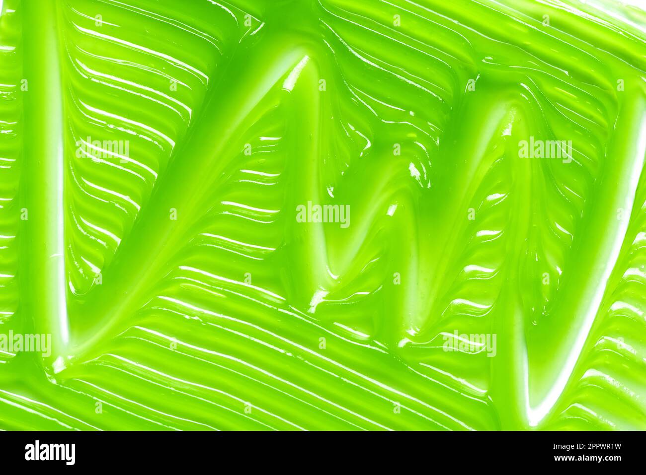Green gel slime, cosmetic product as background, skin care mask or ...