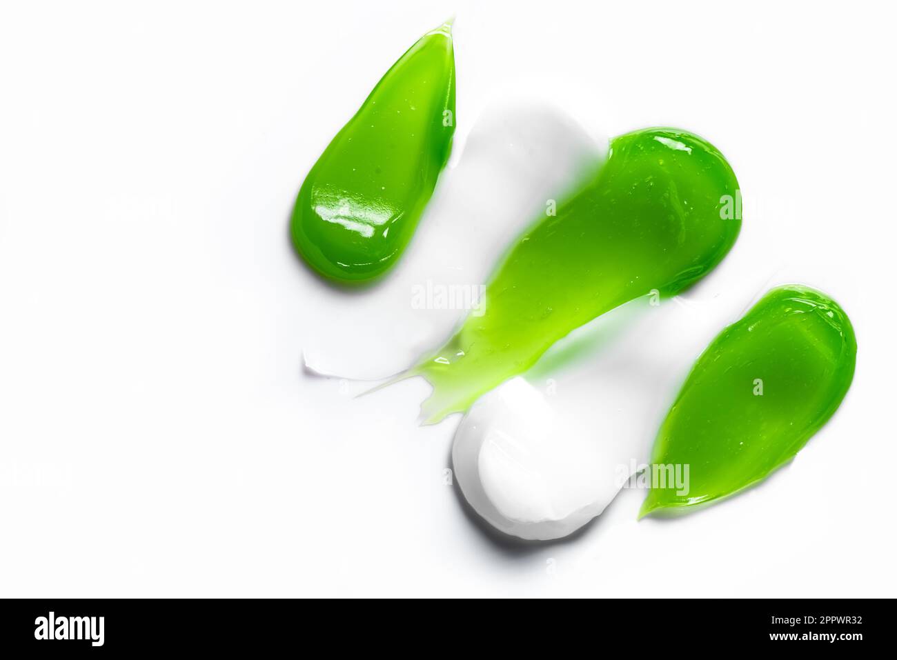 Green and white gel samples isolated on white background, close up ...