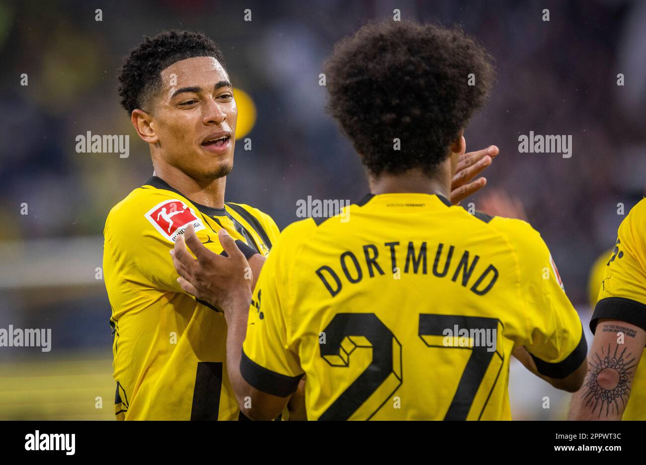 Dortmund, Germany. 22nd Apr, 2023. Karim Adeyemi (BVB) bekommt von Jude ...