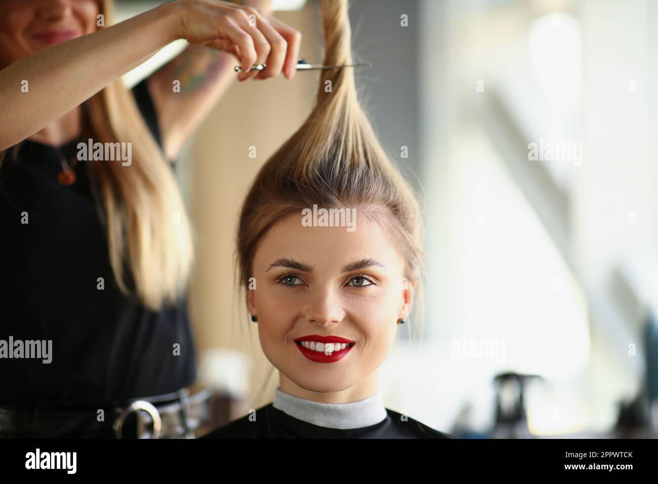 Hand cutting ponytail hi-res stock photography and images - Alamy