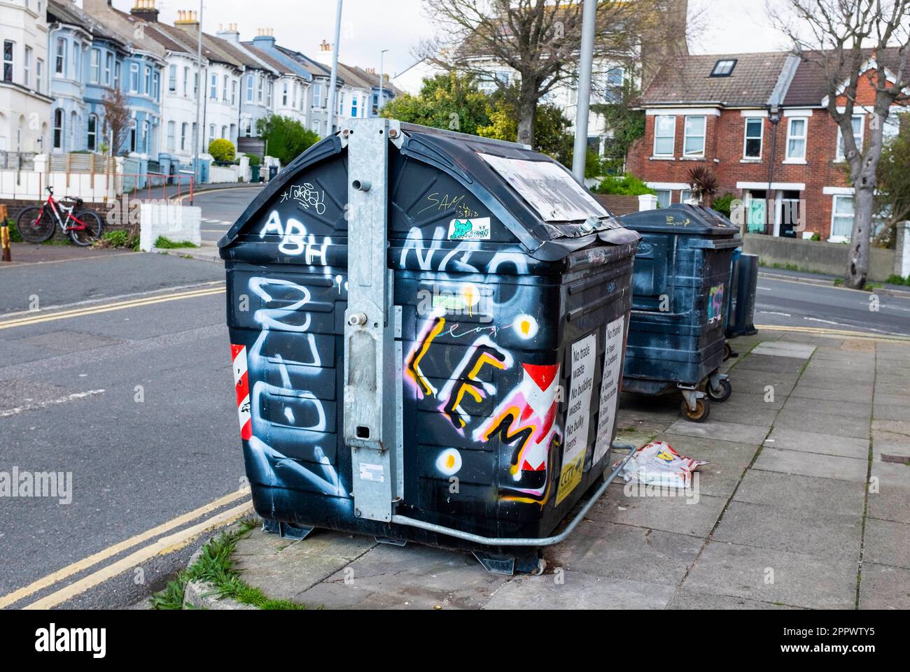 Graffiti covered Brighton & Hove city council communal bins near Queens ...
