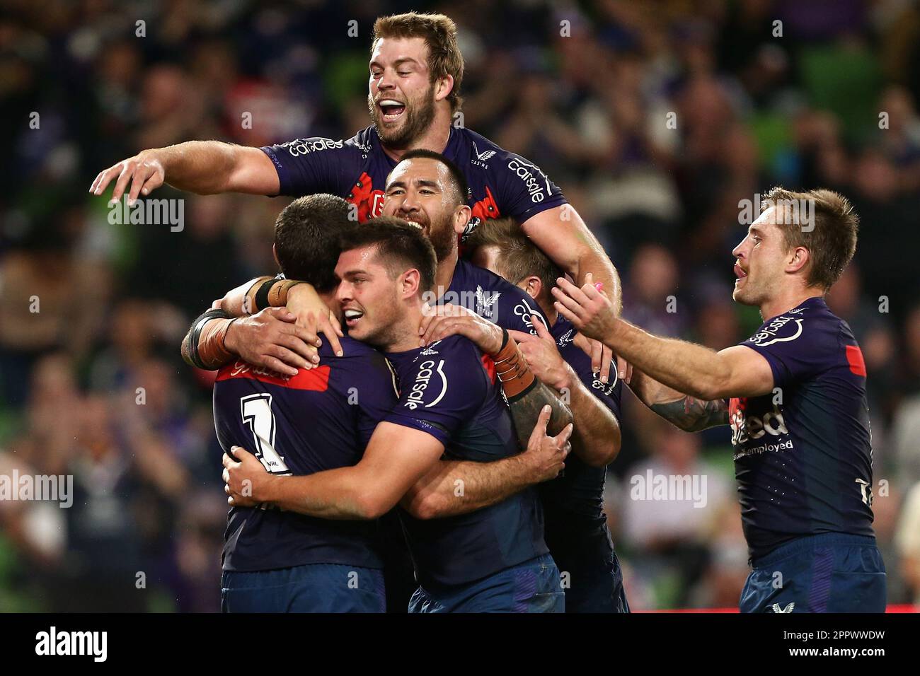 Nick Meaney of the Storm celebrates a try during the NRL Round 8 match ...