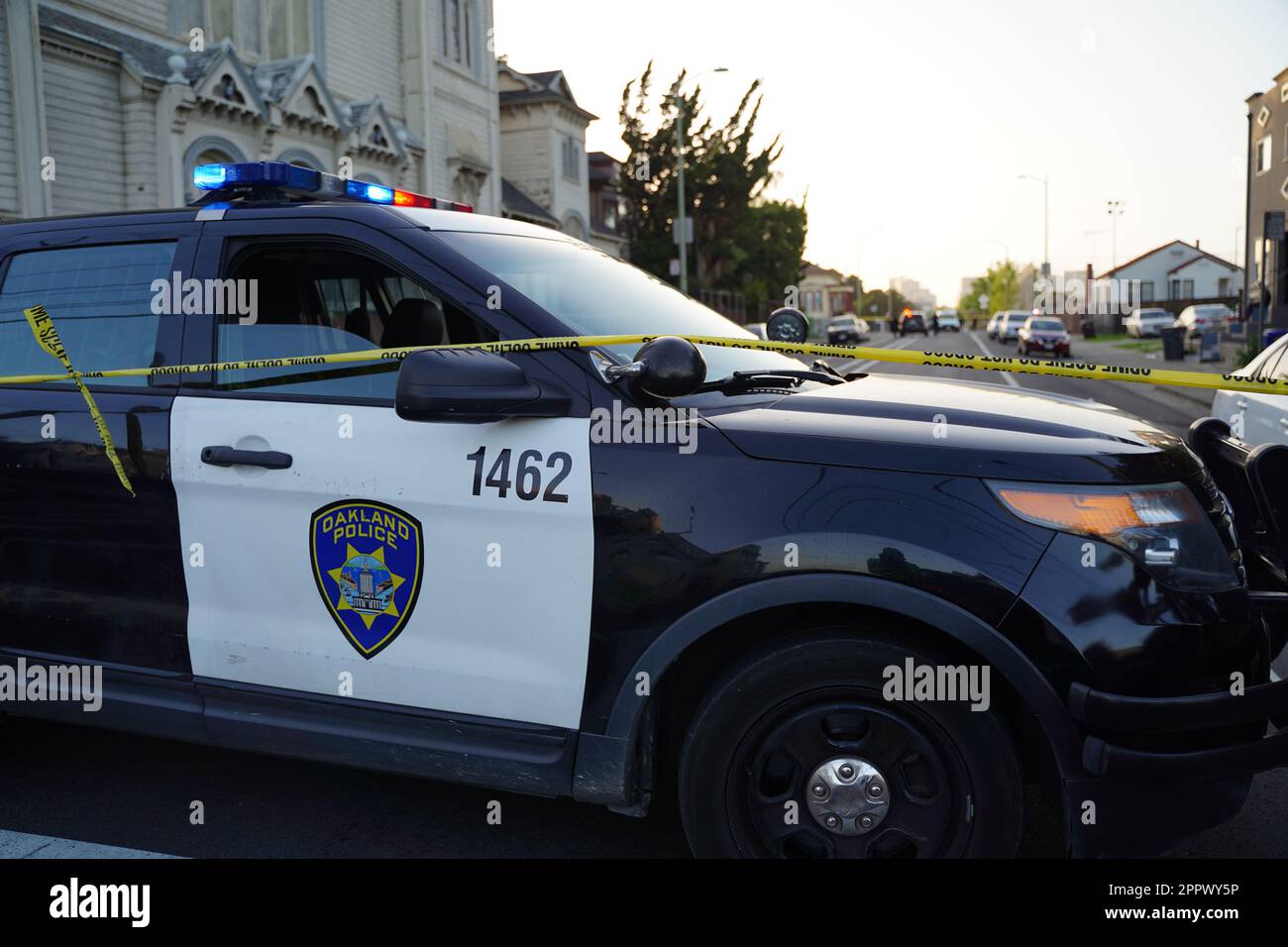 Police officers use a cop vehicle and a cordon line to blockade the ...