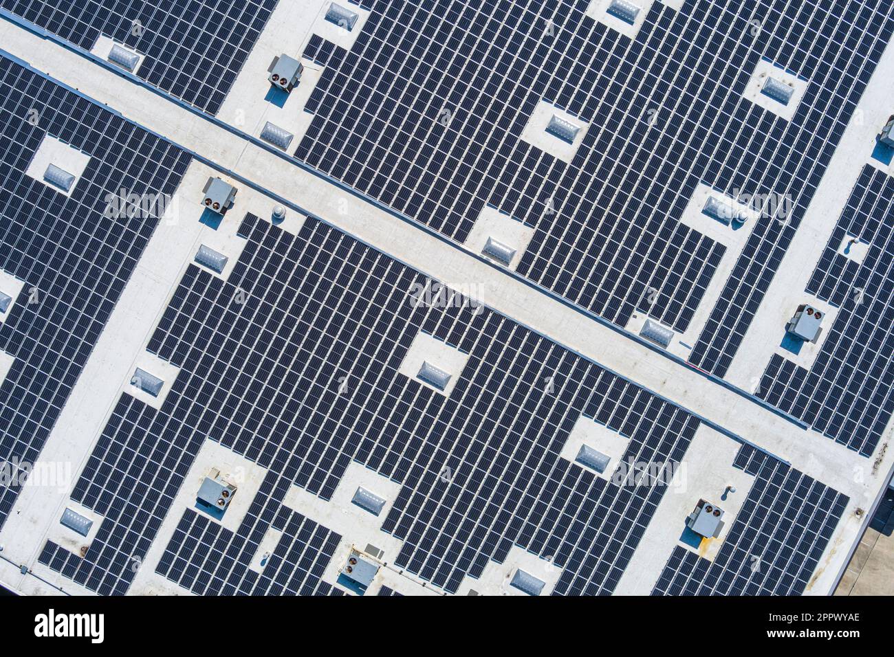 Aerial view of solar panels on roof of commercial building, New Jersey ...