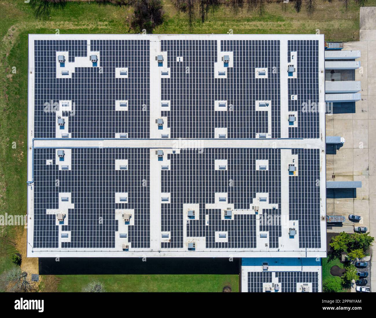 Aerial view of solar panels on roof of commercial building, New Jersey ...
