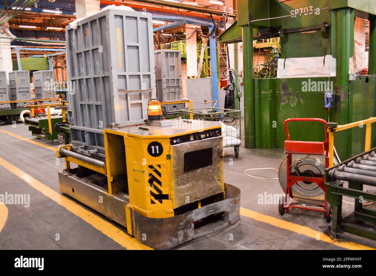 Self-propelled, autonomous yellow metal trolley, machine with emergency ...