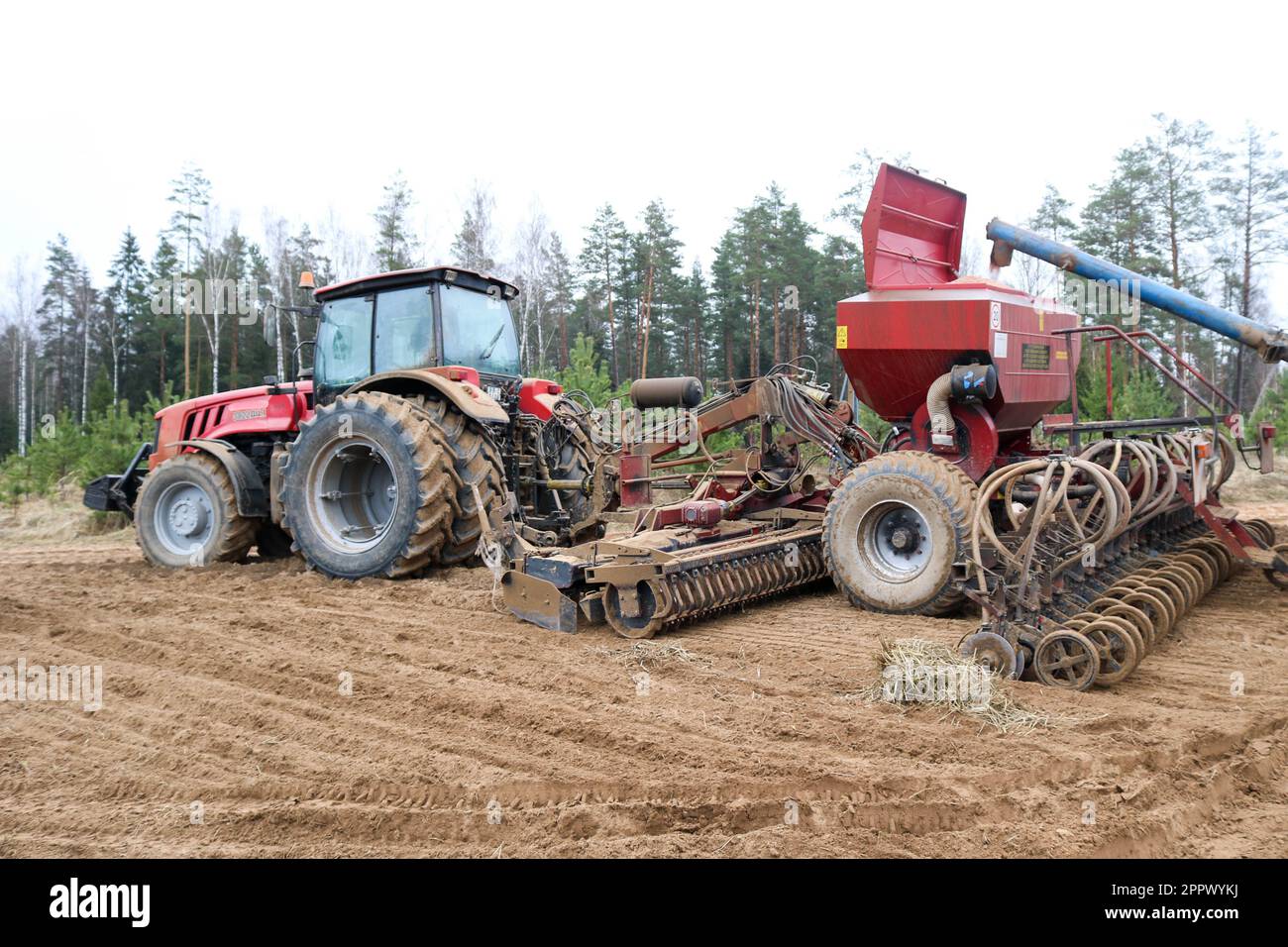 A tractor with a connected sowing unit, a combine, a drill with large ...