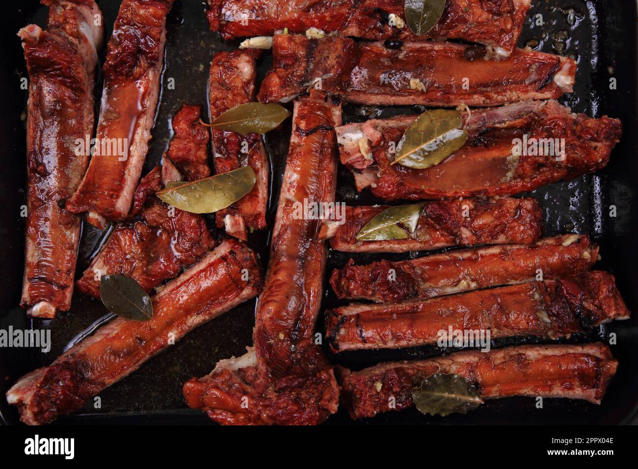 smoked pig ribs as very nice food background Stock Photo - Alamy
