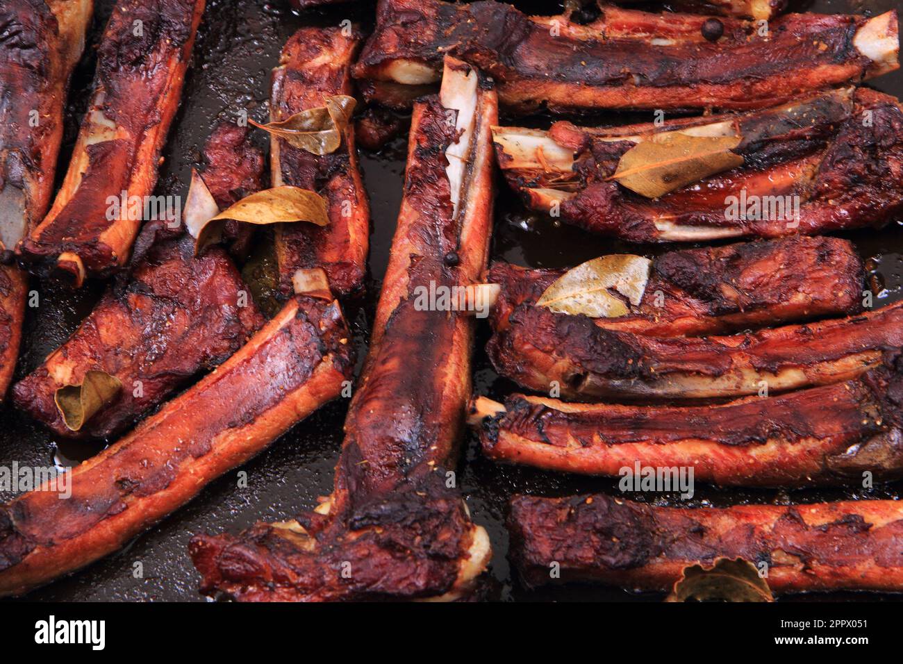 smoked pig ribs as very nice food background Stock Photo - Alamy